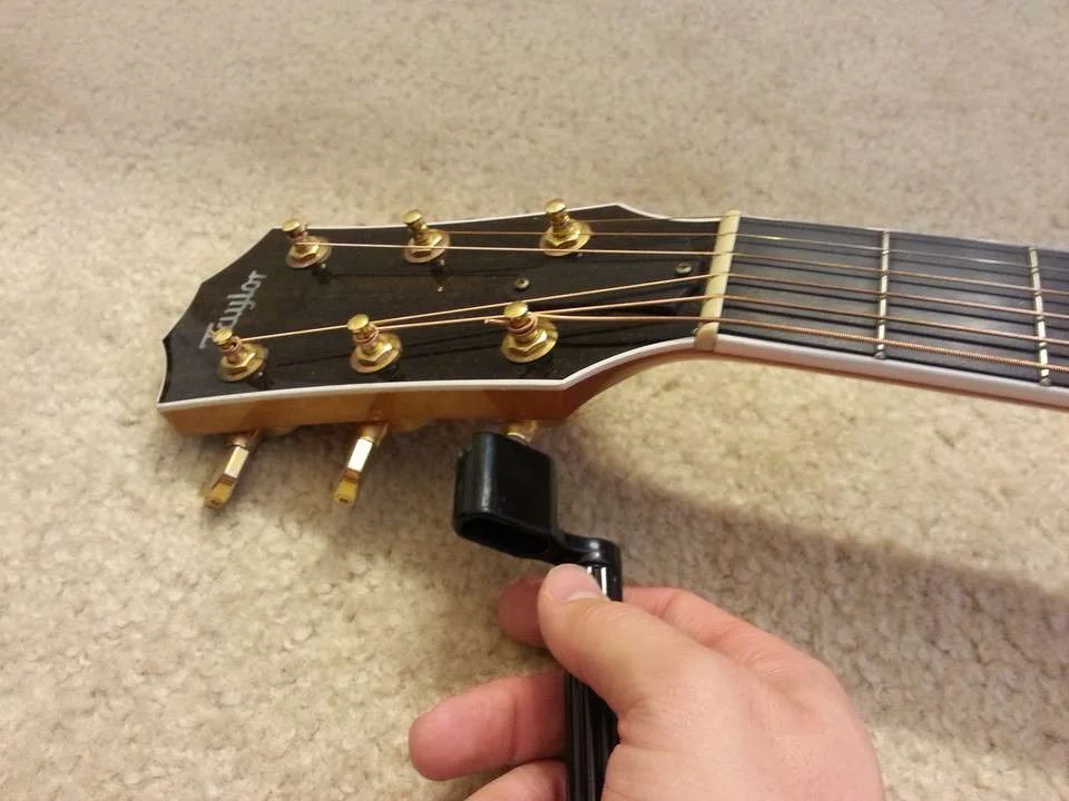 How To Restring An Acoustic Guitar - Guitar Tunio